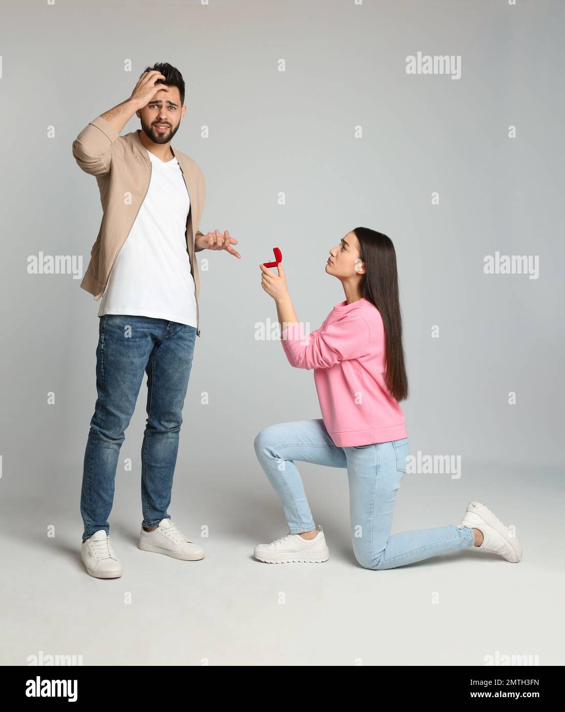 Young woman with engagement ring making marriage proposal to her ...