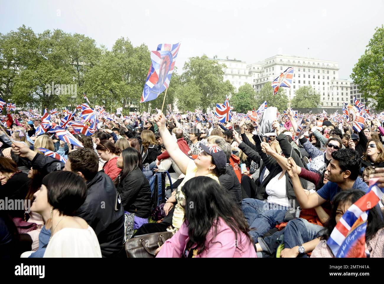 Thousands of well wishers crowd the grounds outside Buckingham Palace to show their support for ...