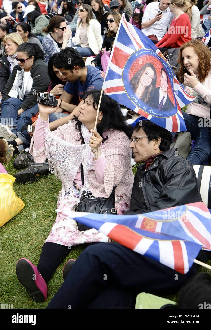 Thousands of well wishers crowd the grounds outside Buckingham Palace to show their support for ...
