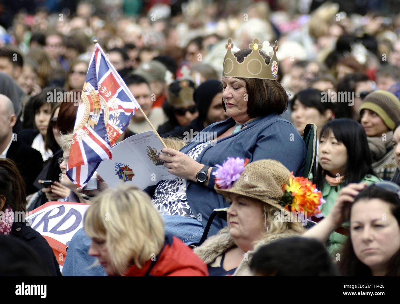 Thousands of well wishers crowd the grounds outside Buckingham Palace to show their support for ...