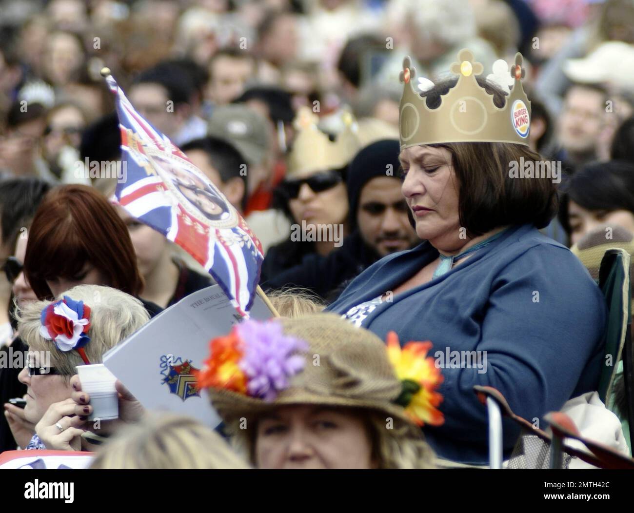 Thousands of well wishers crowd the grounds outside Buckingham Palace to show their support for ...