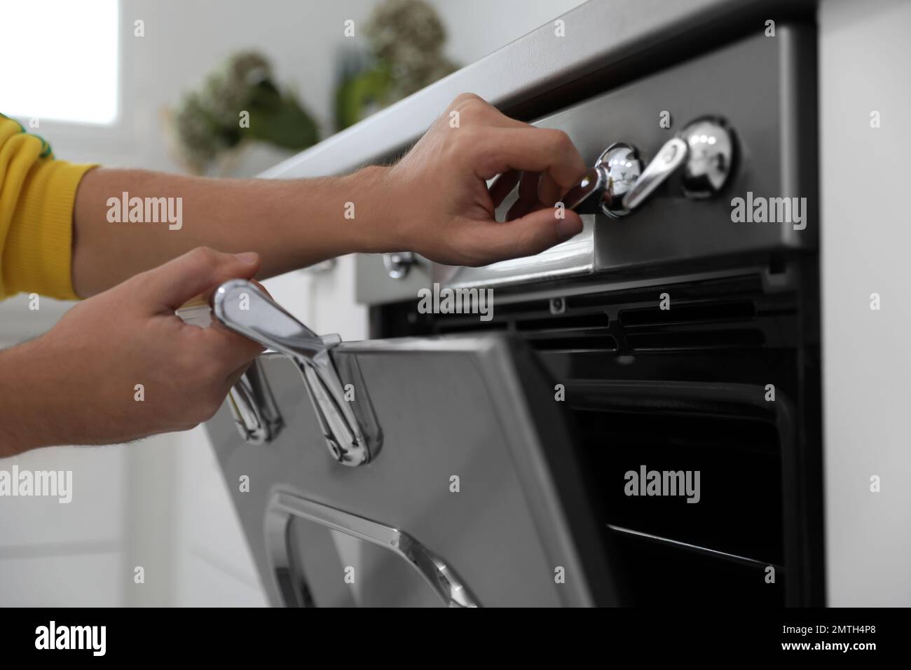 Person using gas cooker hi-res stock photography and images - Alamy