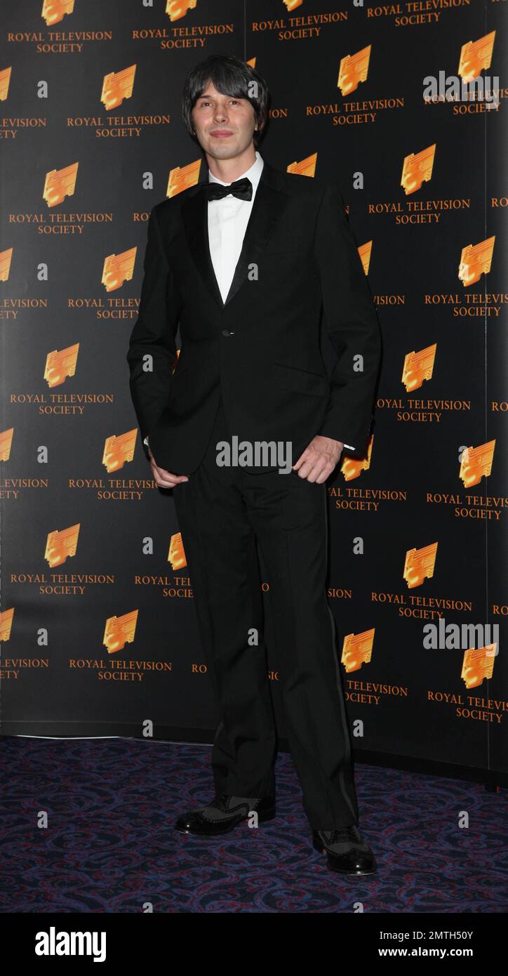 Scientist and ex-rock star Professor Brian Cox poses for photographers ...