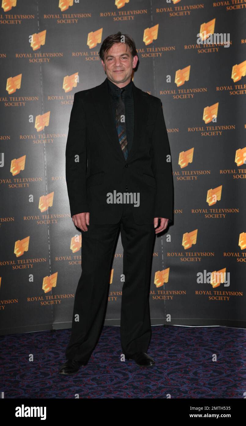 John Michie poses for photographers at the Royal Television Society ...