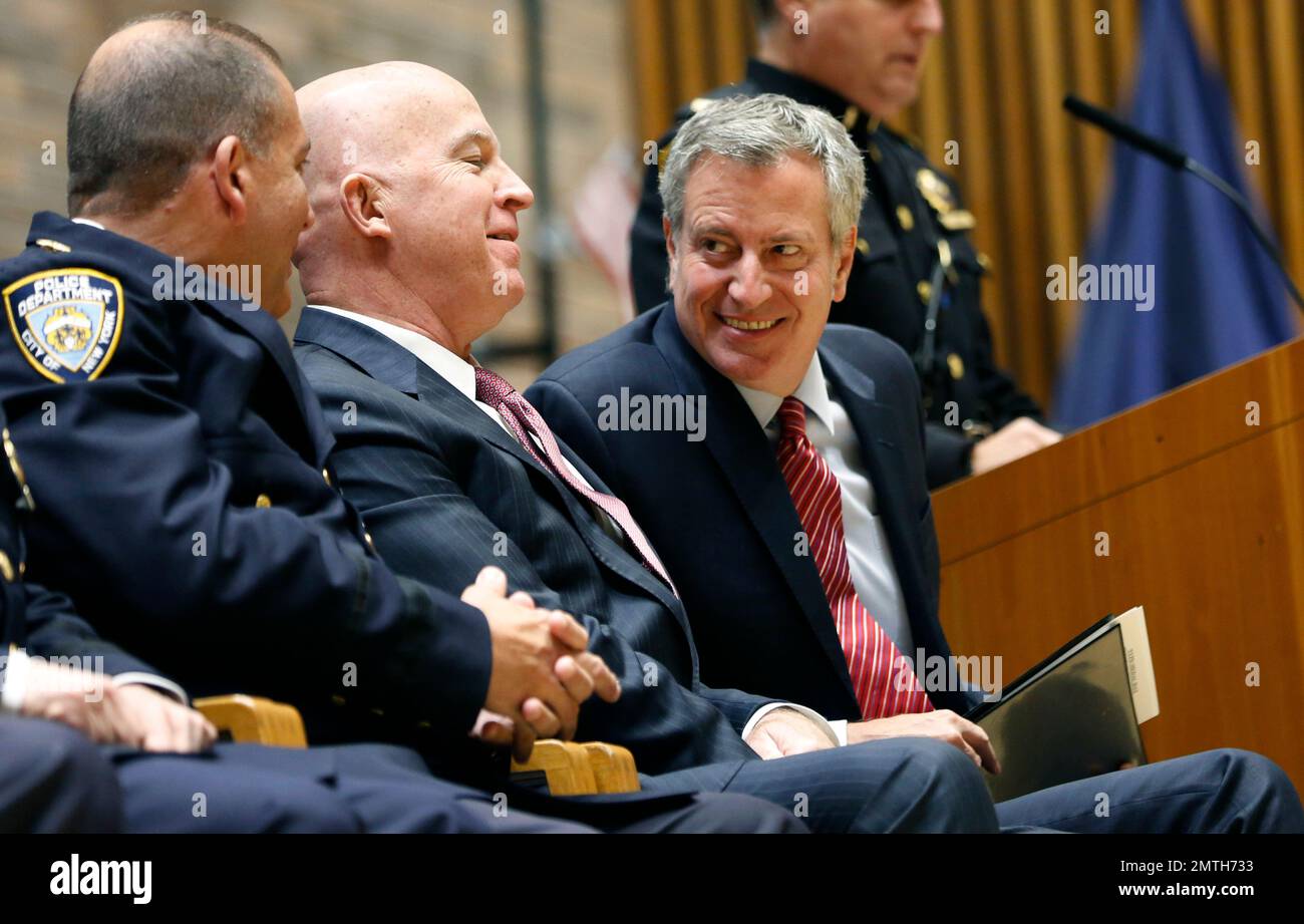 New York City Mayor Bill de Blasio, right, chats with New York Police ...