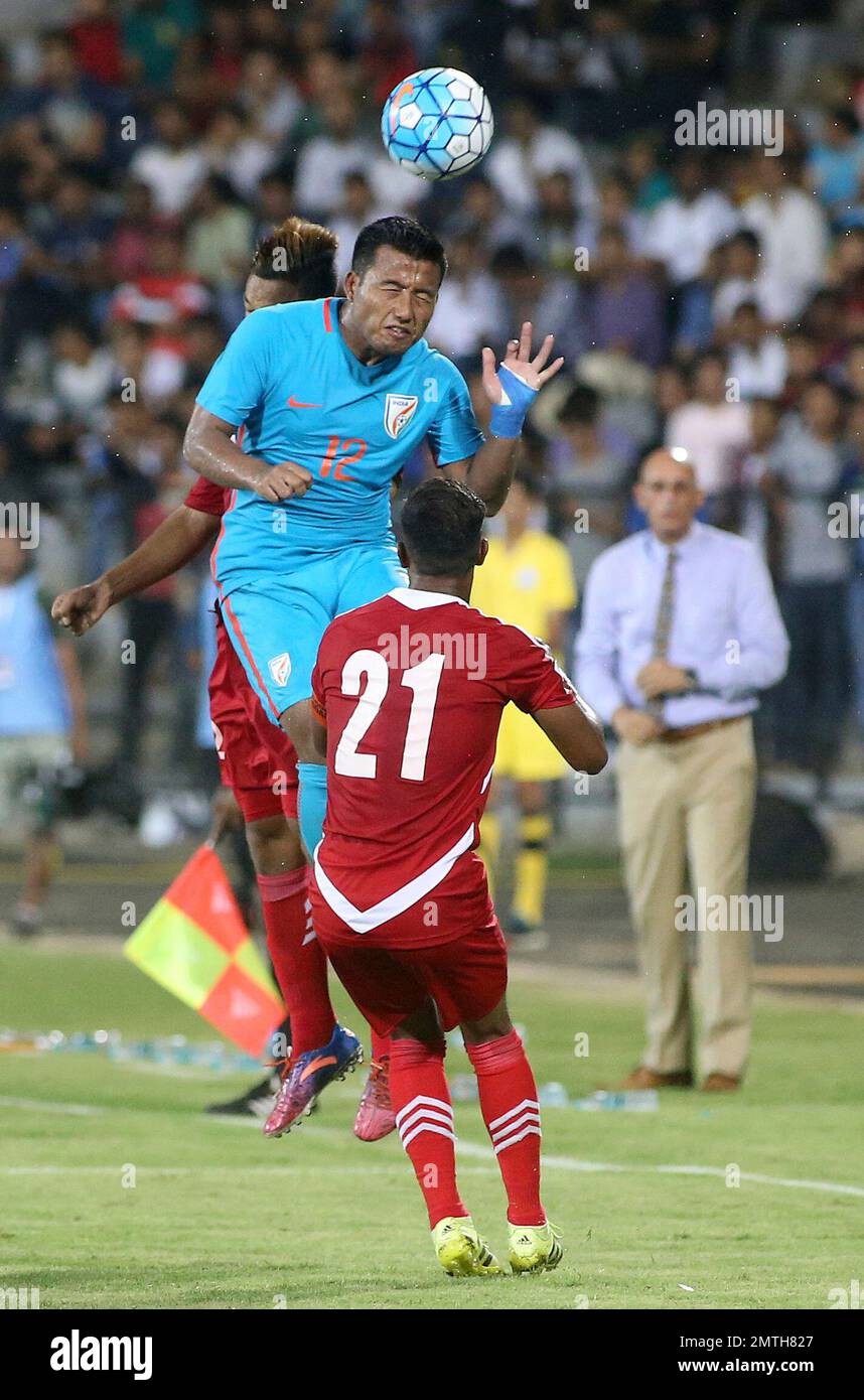India's Jeje Lalpekhlua, blue saves ball from Nepal's Bharat Khawas ...