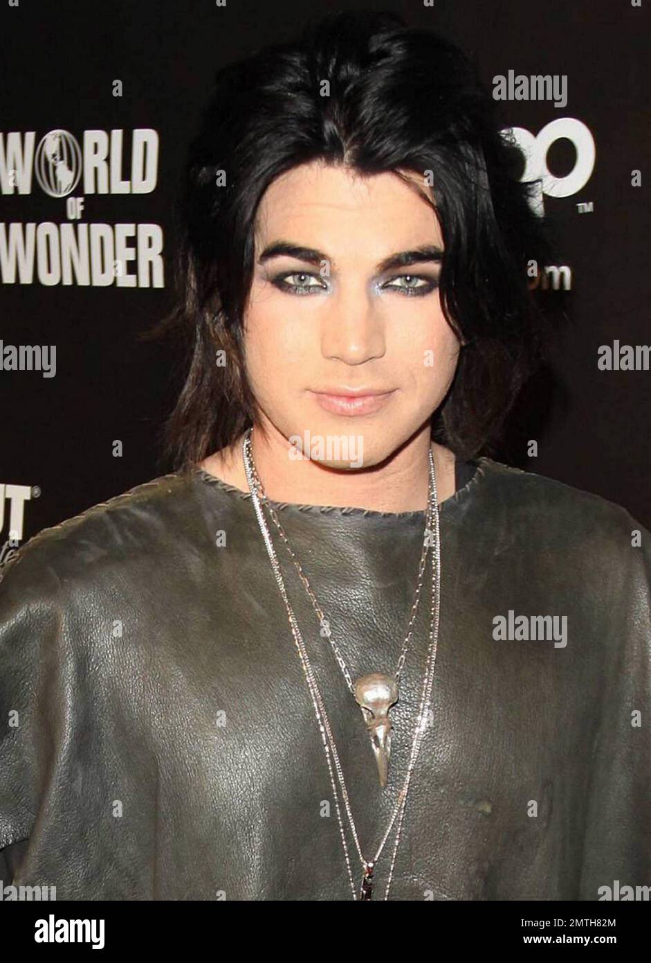 In a leather fringe poncho, leather bellbottoms and blue eye makeup ...