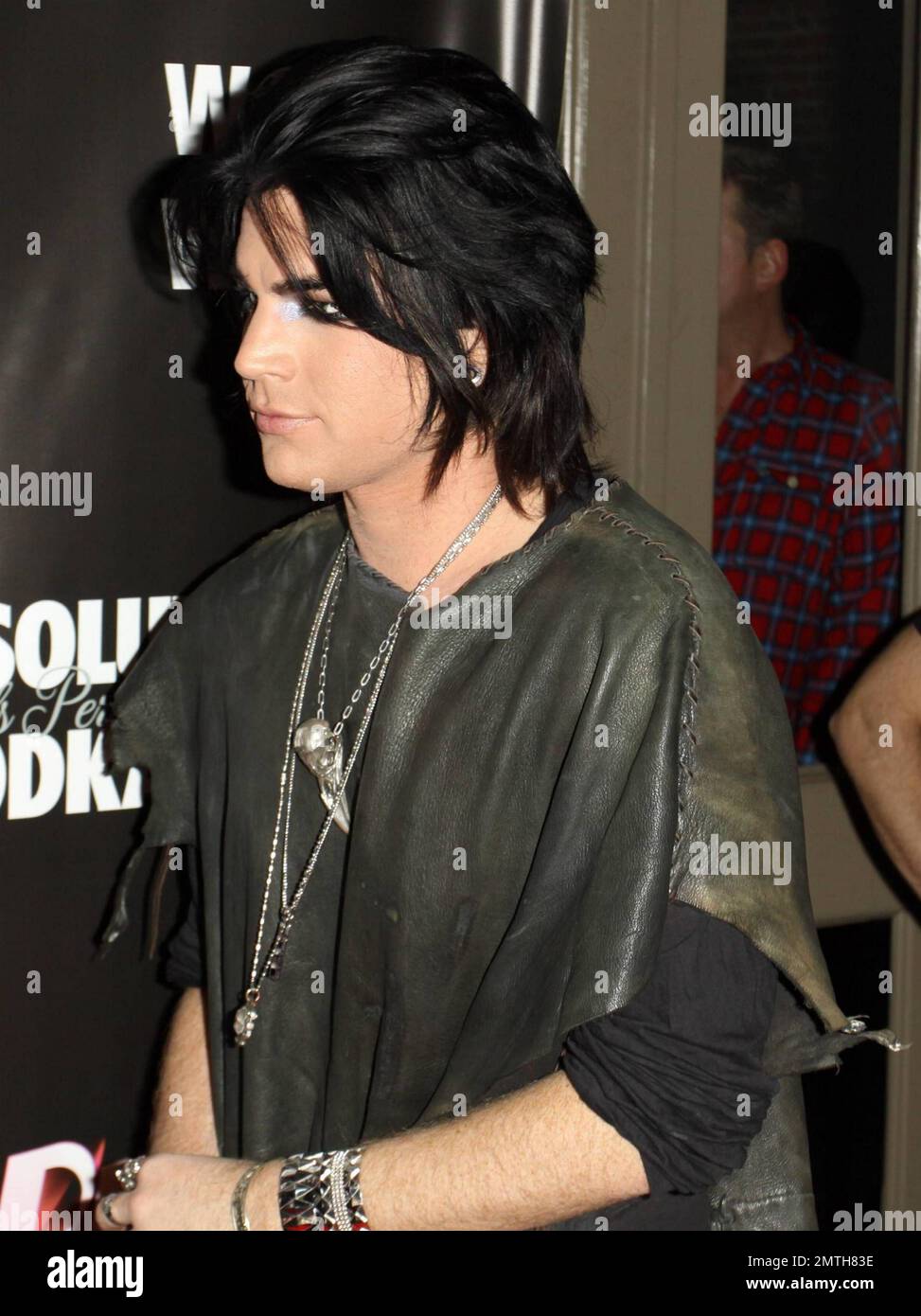 In a leather fringe poncho, leather bellbottoms and blue eye makeup ...