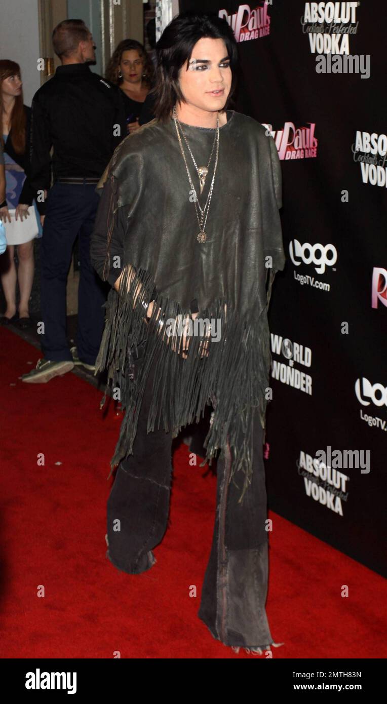 In a leather fringe poncho, leather bellbottoms and blue eye makeup ...