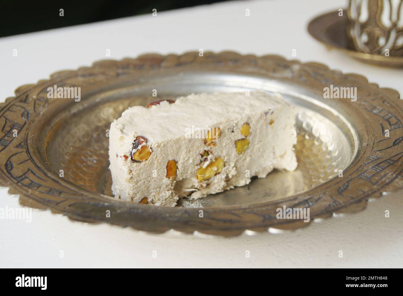 Halva is an Arabic sweet and consists of a paste that is based on ...