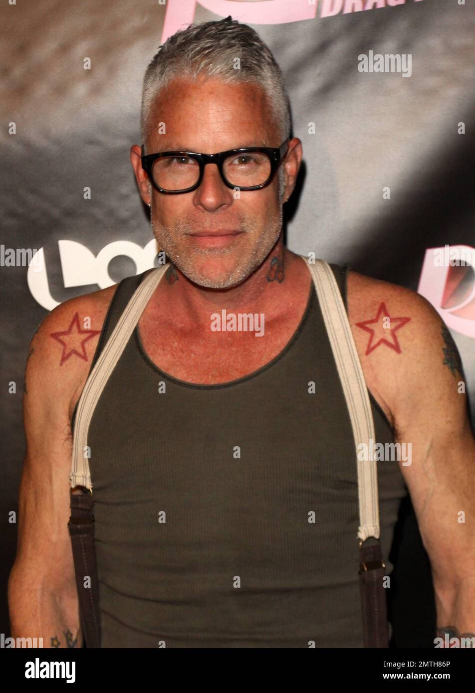 Makeup artist Billy B poses for photographers on the red carpet at Rage ...