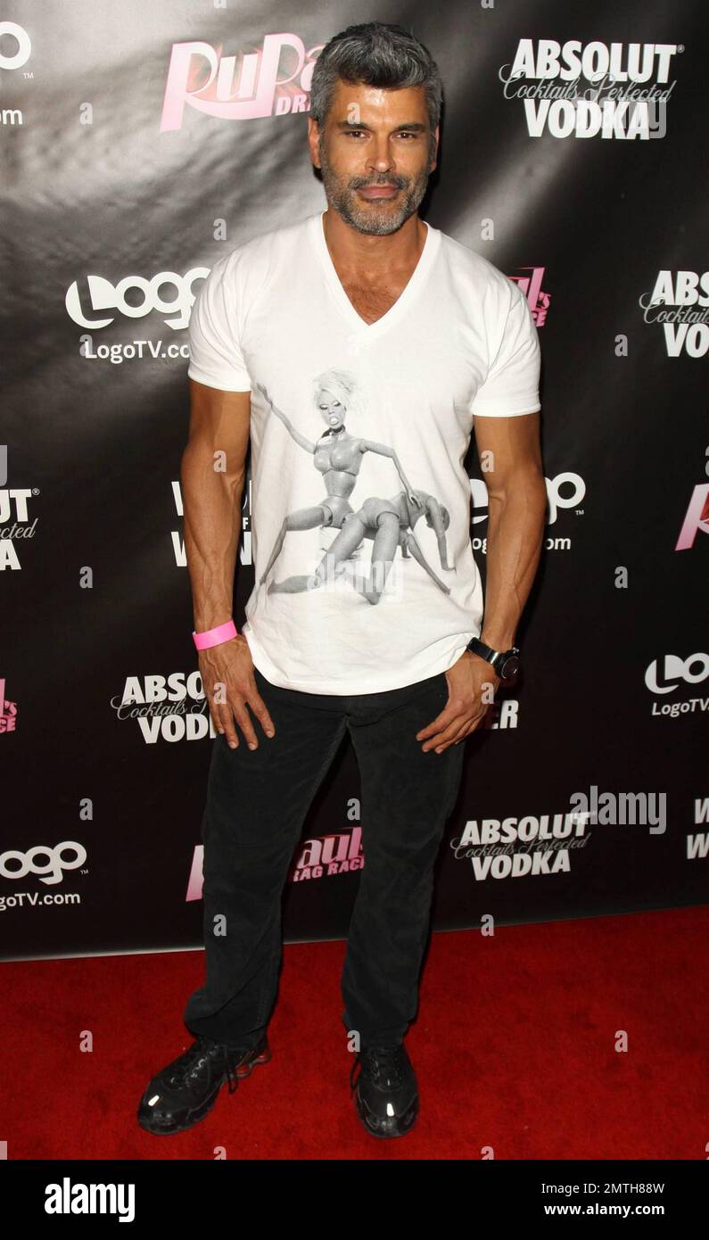 Photographer Mike Ruiz wears a comical shirt and poses for ...