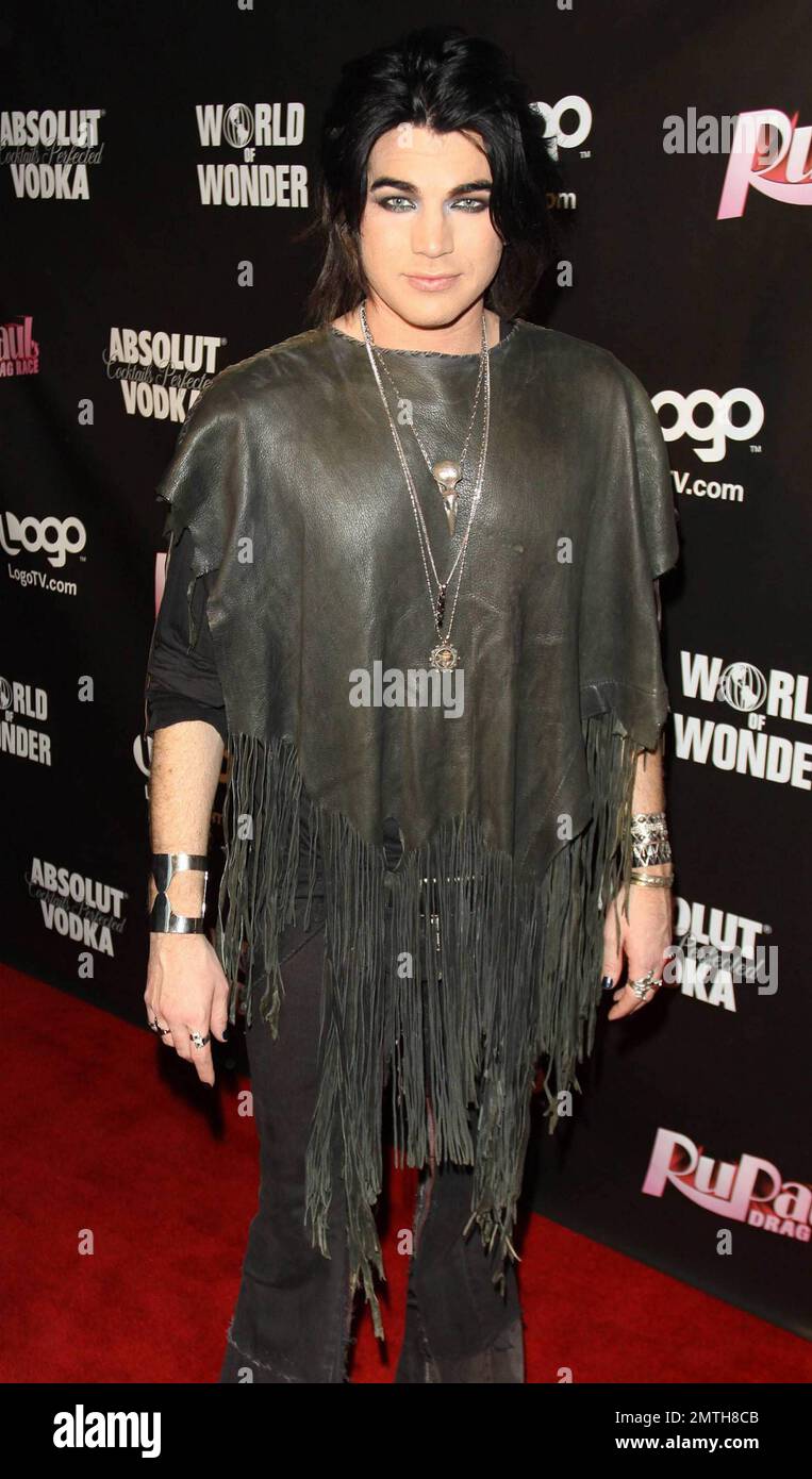 In a leather fringe poncho, leather bellbottoms and blue eye makeup ...