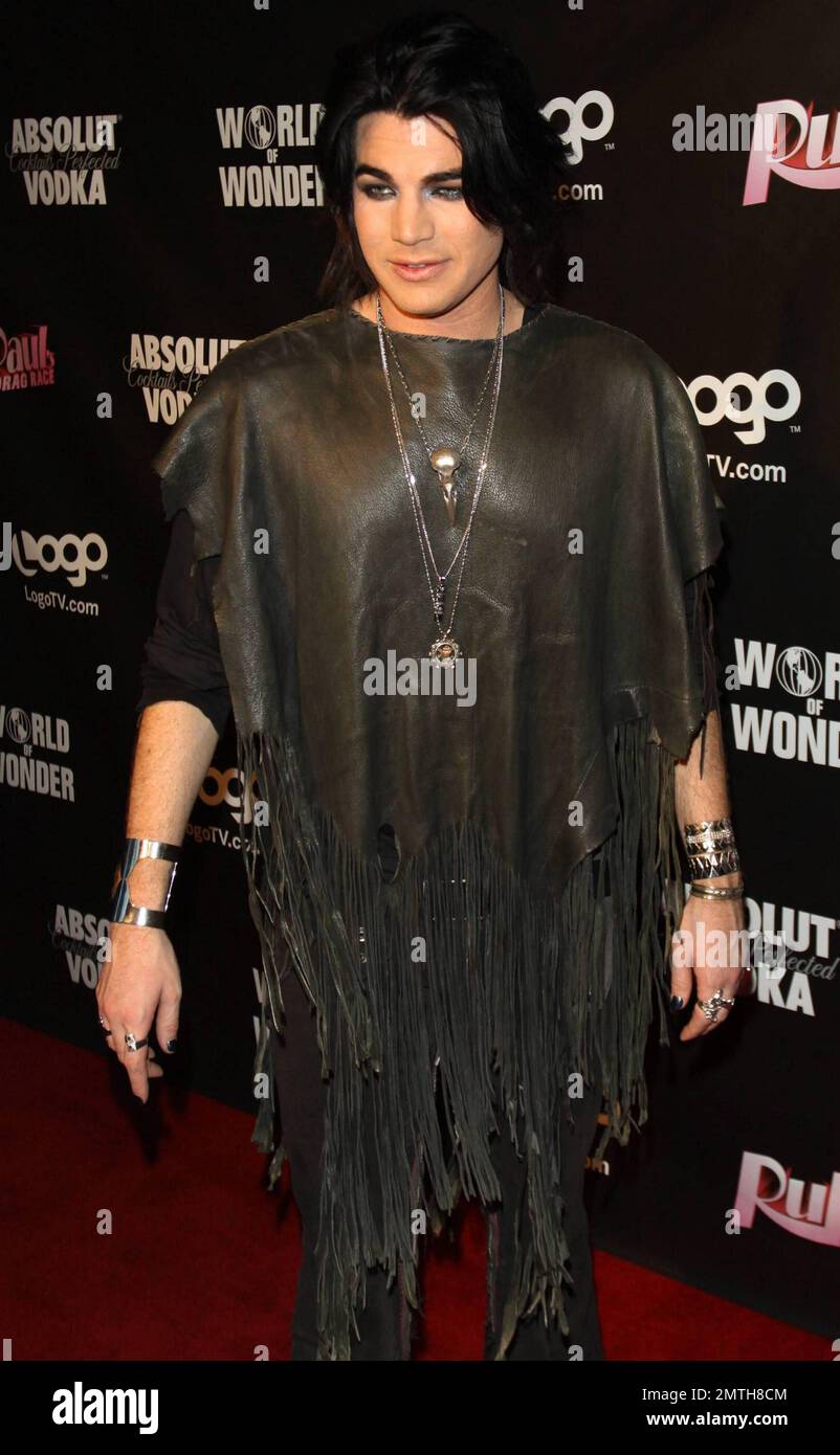 In a leather fringe poncho, leather bellbottoms and blue eye makeup ...