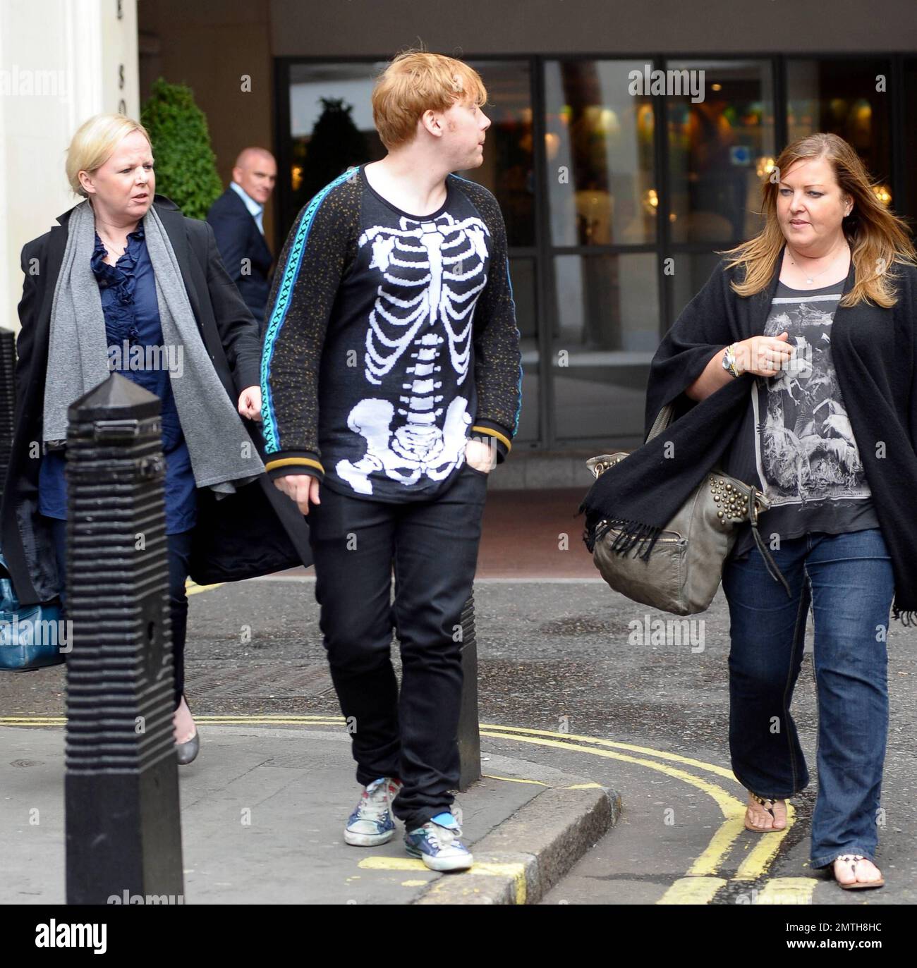 "Harry Potter" star Rupert Grint wears a skeleton sweater as he leaves ...