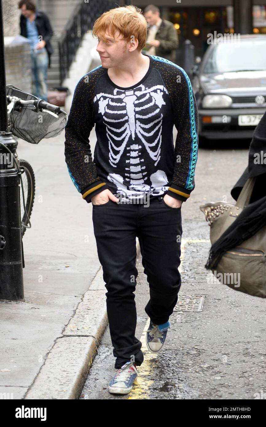 "Harry Potter" star Rupert Grint wears a skeleton sweater as he leaves ...
