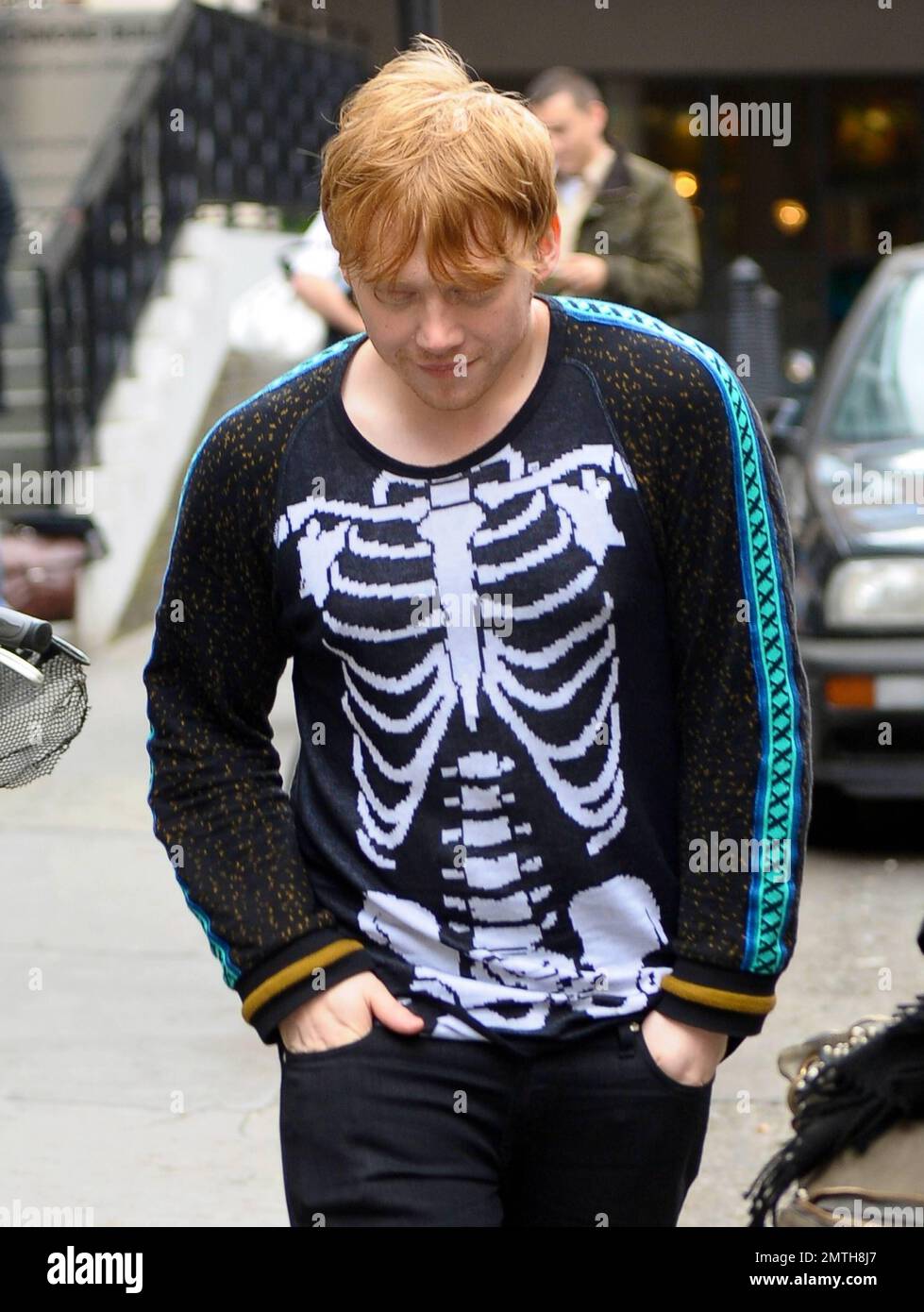 "Harry Potter" star Rupert Grint wears a skeleton sweater as he leaves ...