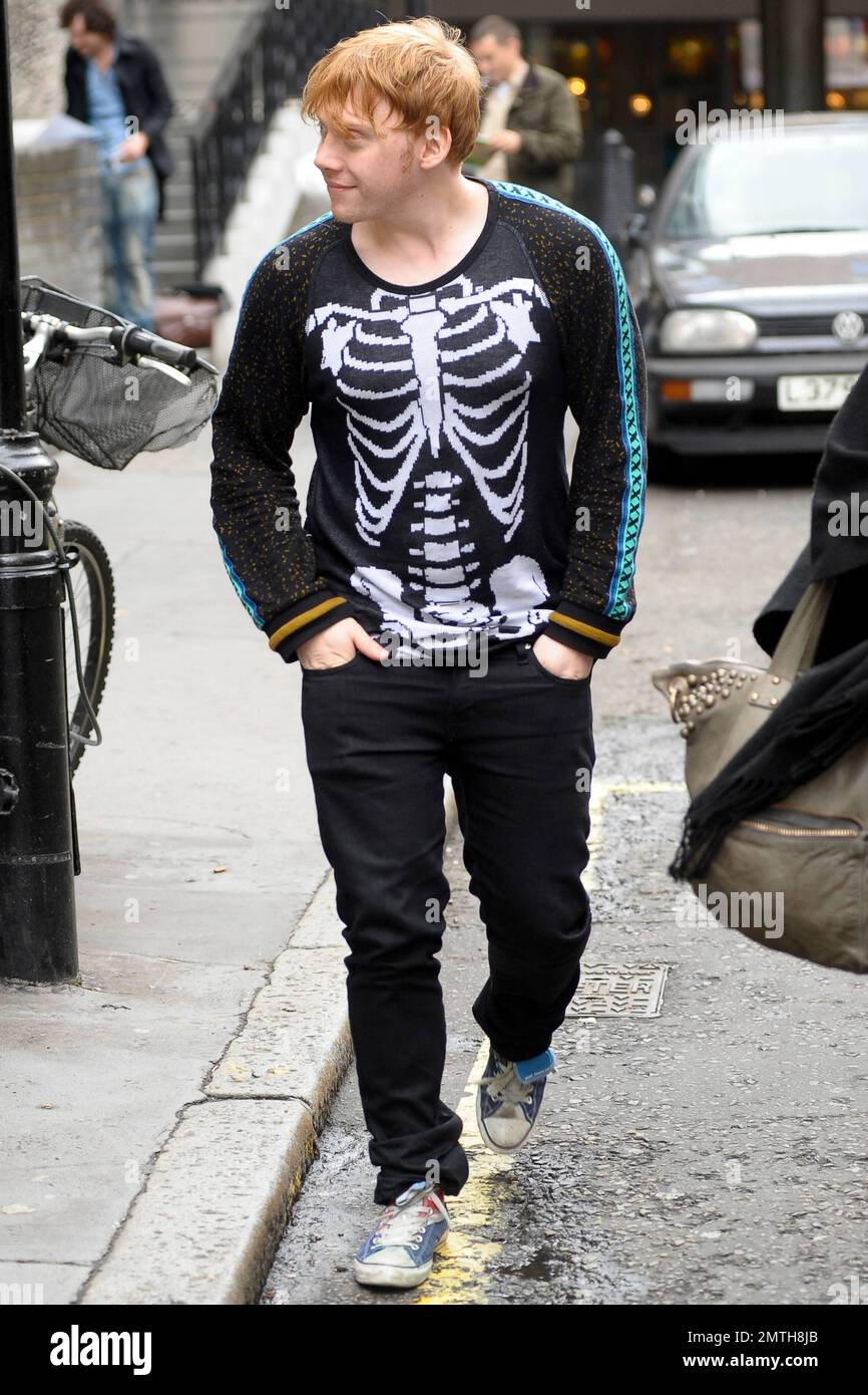"Harry Potter" star Rupert Grint wears a skeleton sweater as he leaves ...