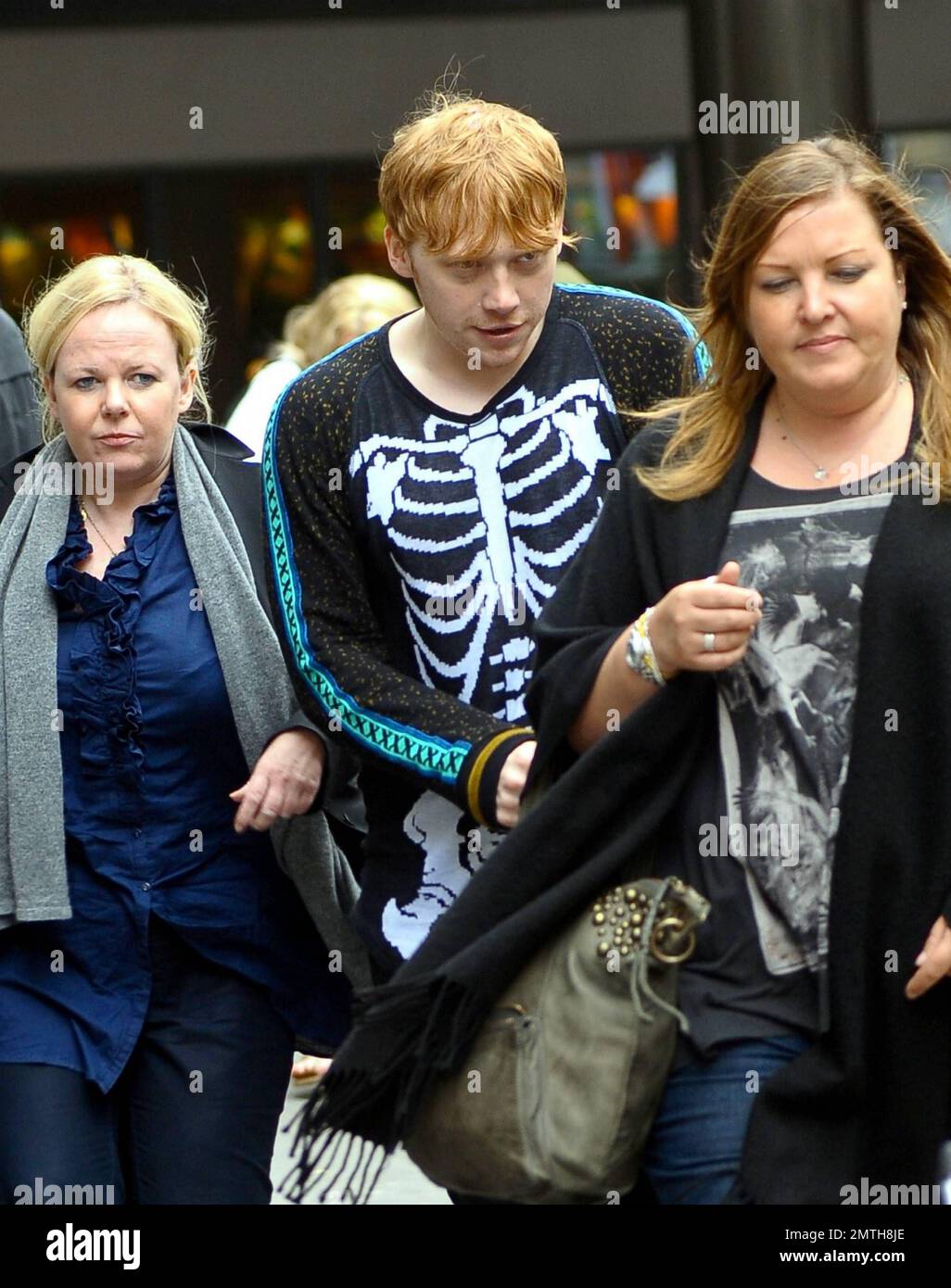 "Harry Potter" star Rupert Grint wears a skeleton sweater as he leaves ...