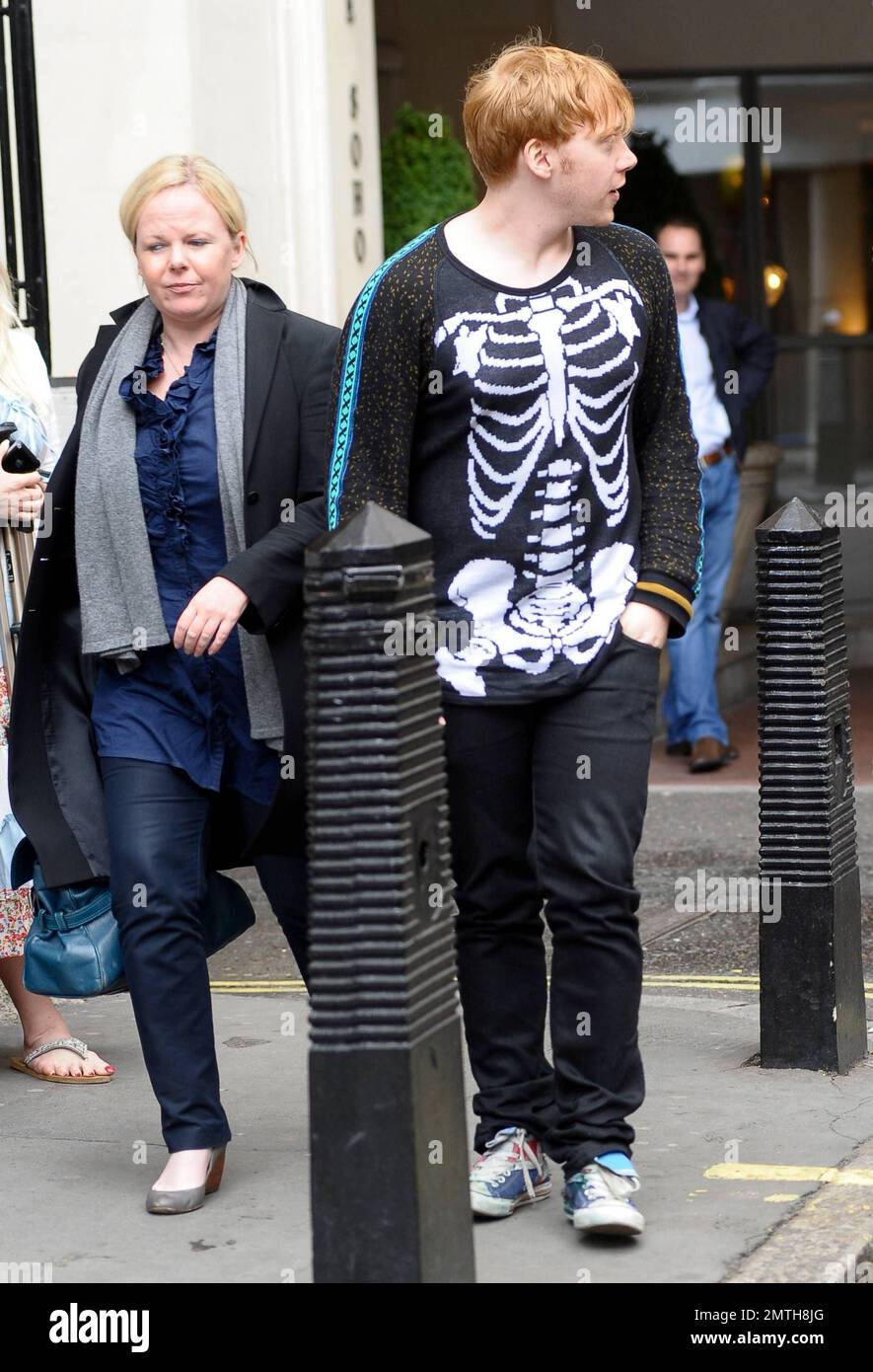 "Harry Potter" star Rupert Grint wears a skeleton sweater as he leaves ...