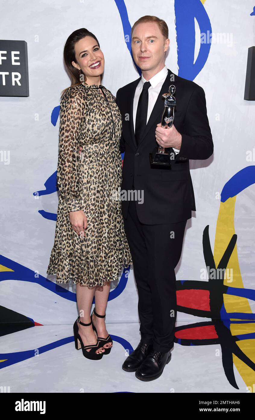 Mandy Moore, left, poses in the press room with Stuart Vevers, winner ...