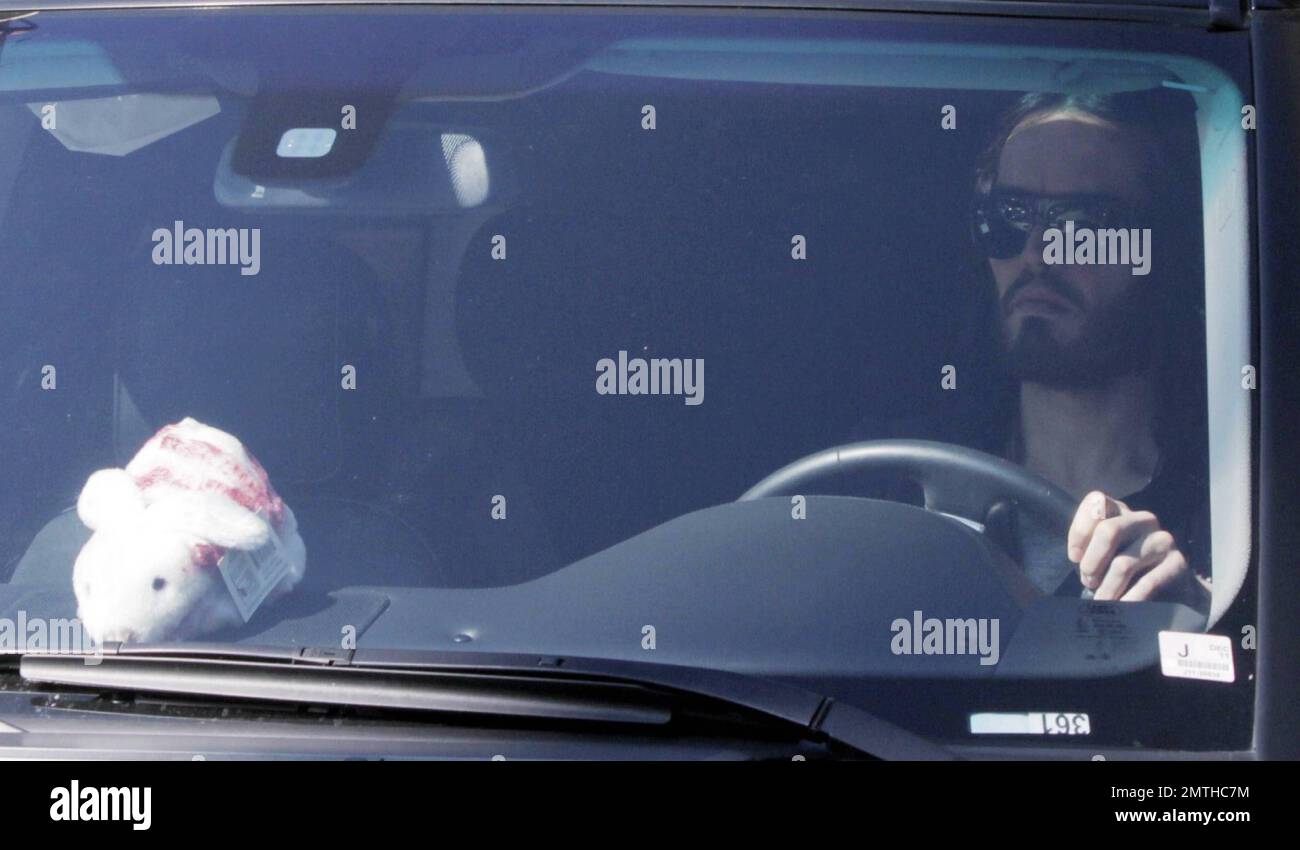 While out and about in West Hollywood, comedian Russell Brand drives ...