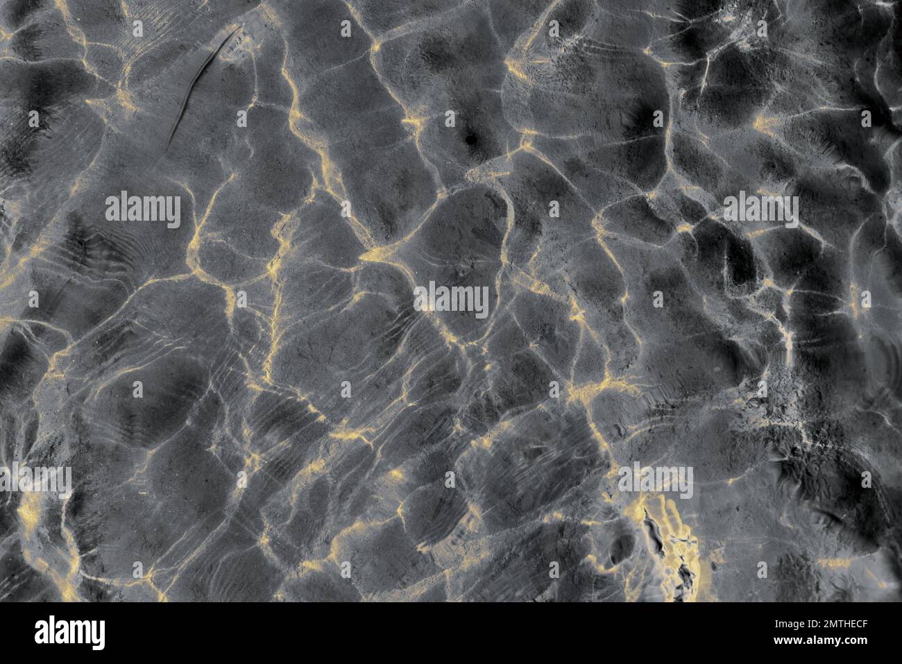 Abstract photo of the glow of the surface of transparent water. The ...