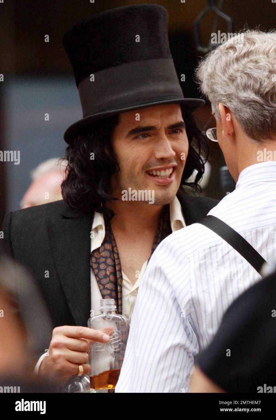 Costumed actor and comedian Russell Brand pretends to be drunk and ...