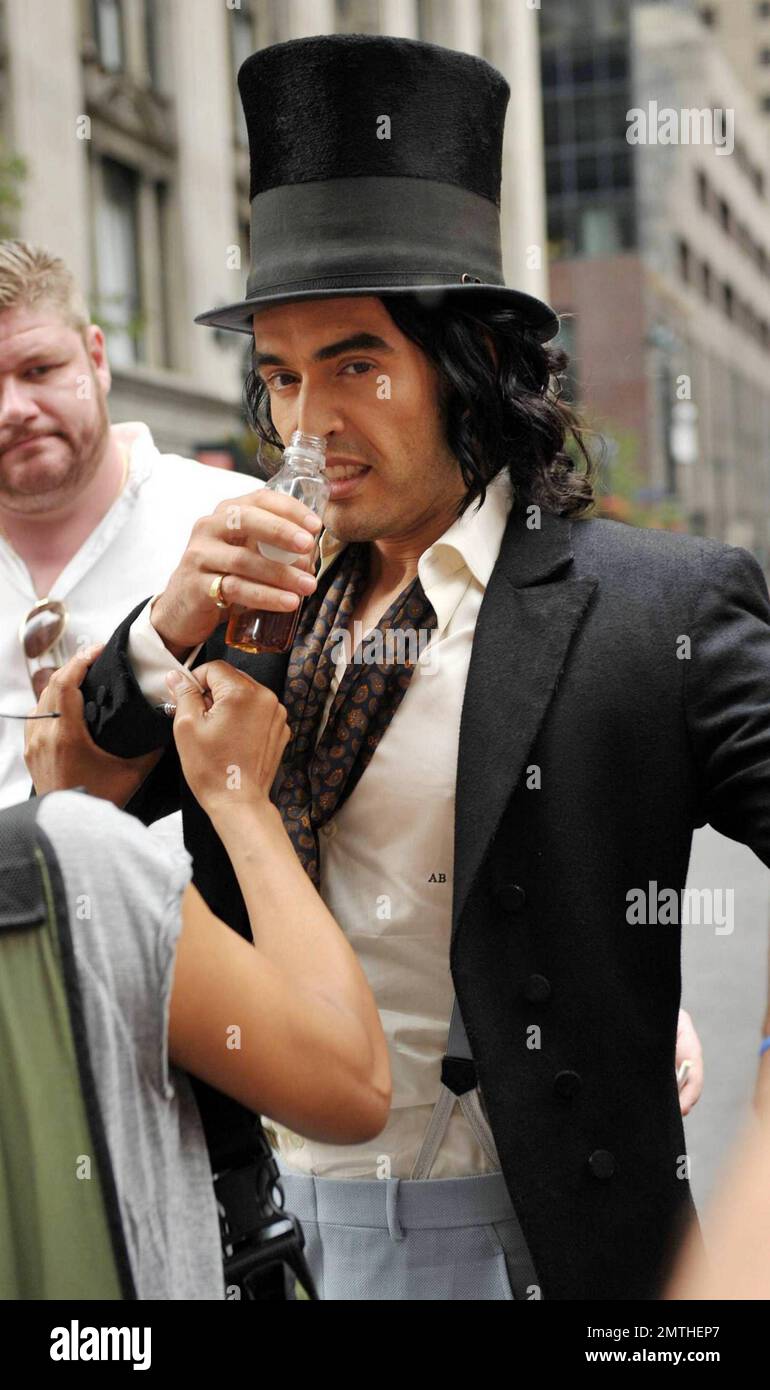 Costumed actor and comedian Russell Brand pretends to be drunk and ...