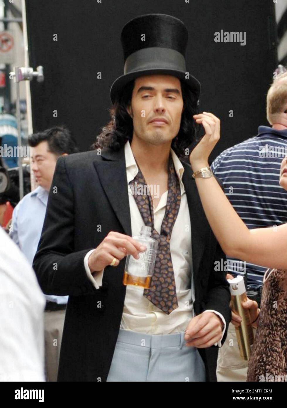 Costumed actor and comedian Russell Brand pretends to be drunk and ...