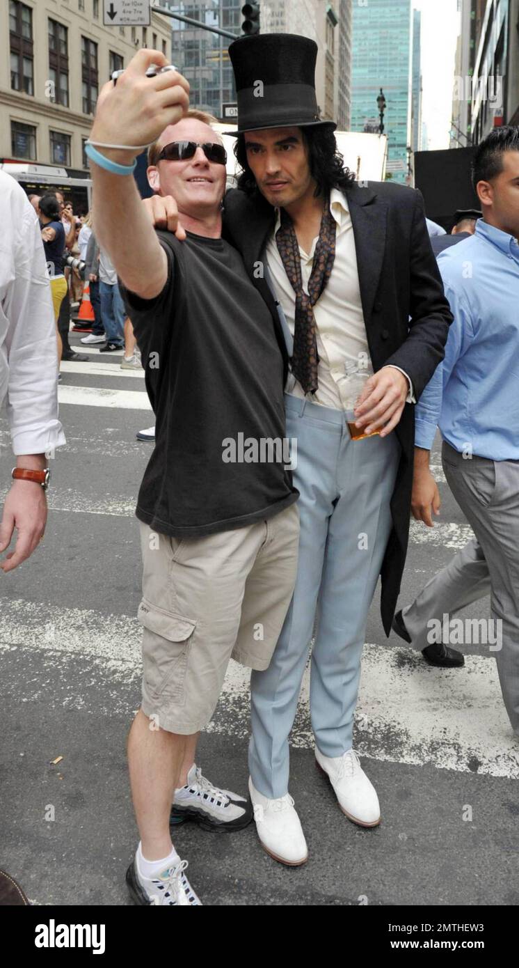 Costumed actor and comedian Russell Brand pretends to be drunk and ...