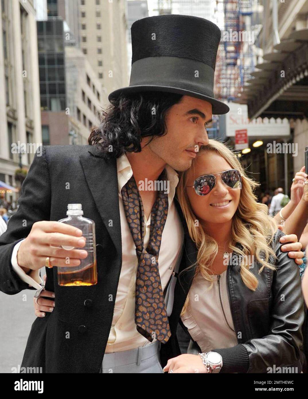 Costumed actor and comedian Russell Brand pretends to be drunk and ...