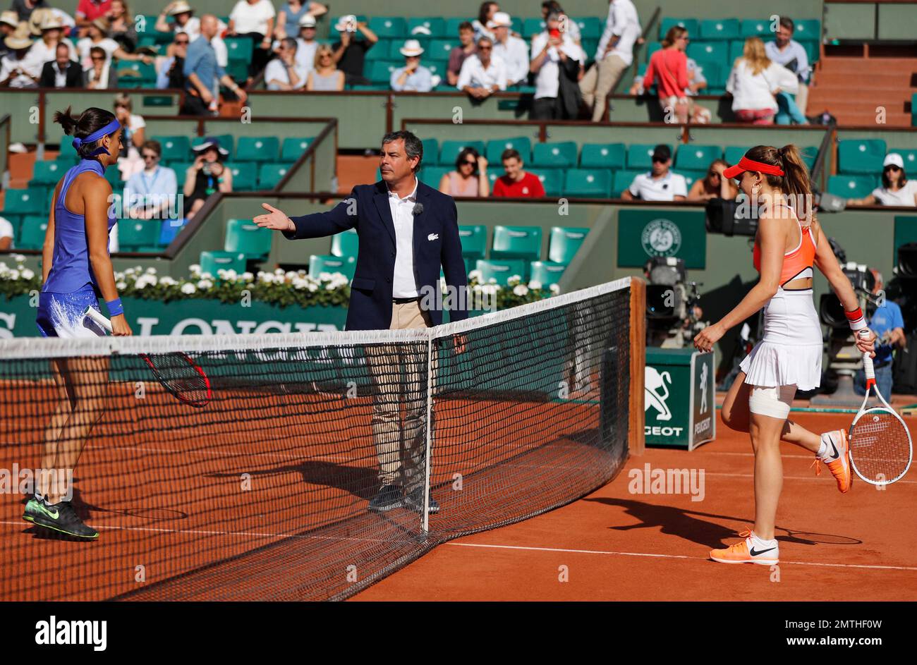 France's Caroline Garcia, left, and France's Alize Cornet, right ...