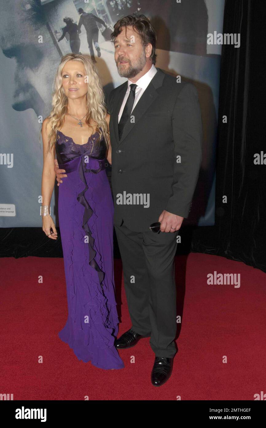 A bearded Russell Crowe wraps his arm around his wife Danielle Spencer ...