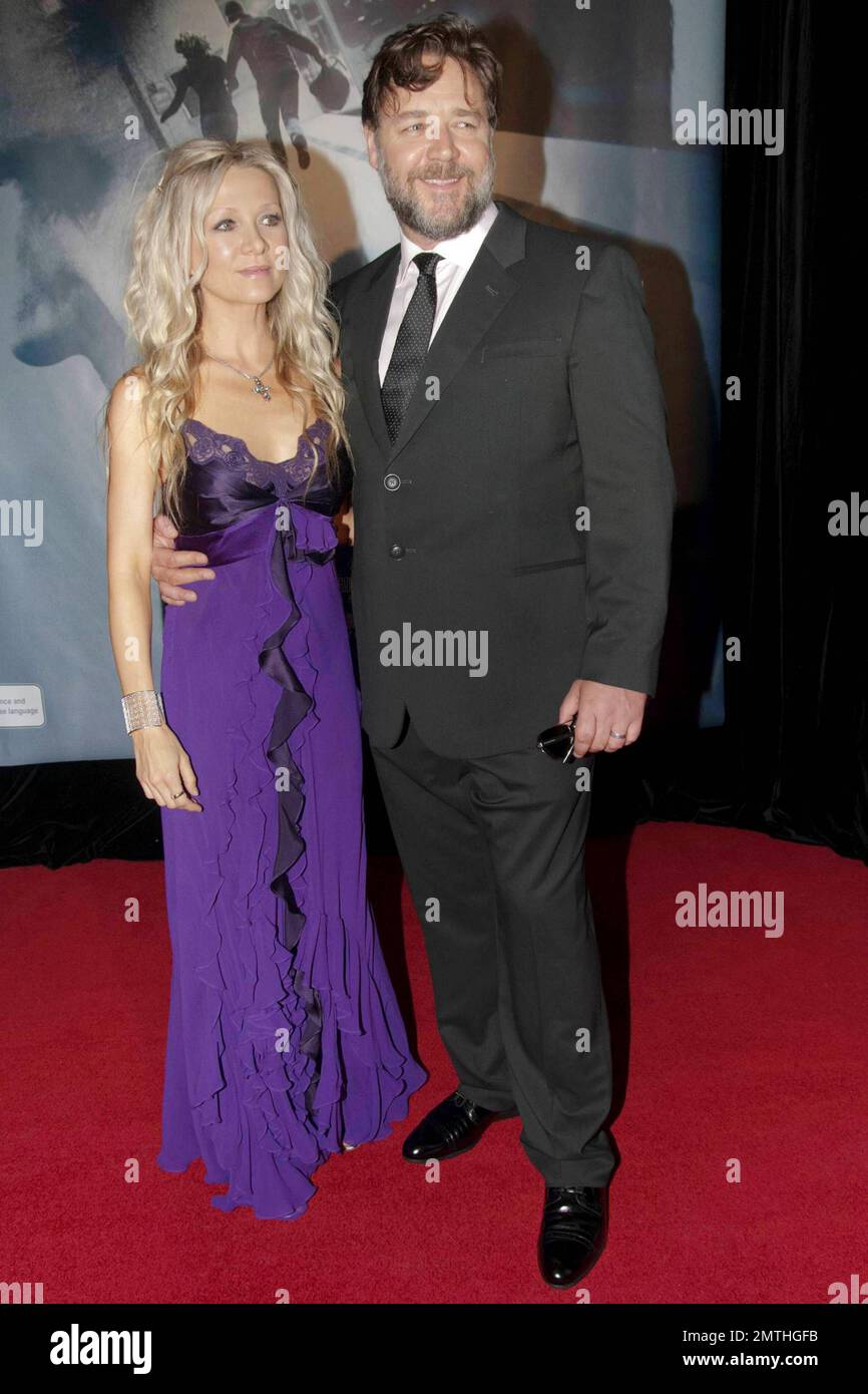 A bearded Russell Crowe wraps his arm around his wife Danielle Spencer ...