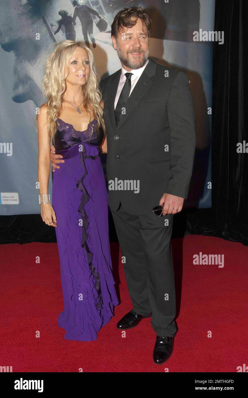 A bearded Russell Crowe wraps his arm around his wife Danielle Spencer ...