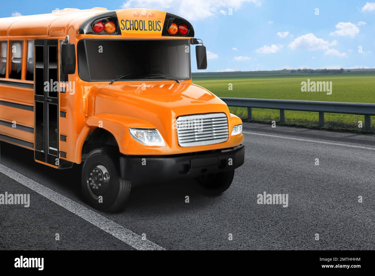 Yellow school bus on road outdoors. Transport for students Stock Photo ...