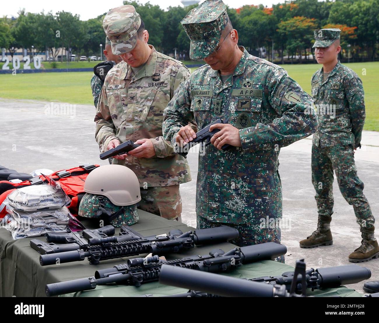 U.S. Army Col. Ernest Lee, left, head of the Joint U.S. Military Assistance Group, and ...
