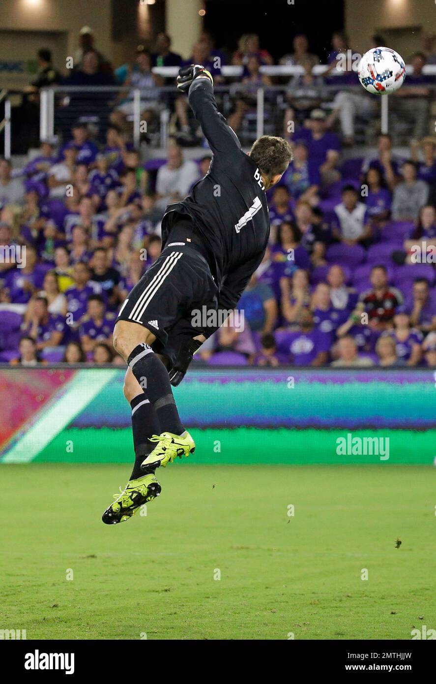 Orlando City goalkeeper Joseph Bendik (1) deflects the ball from the ...