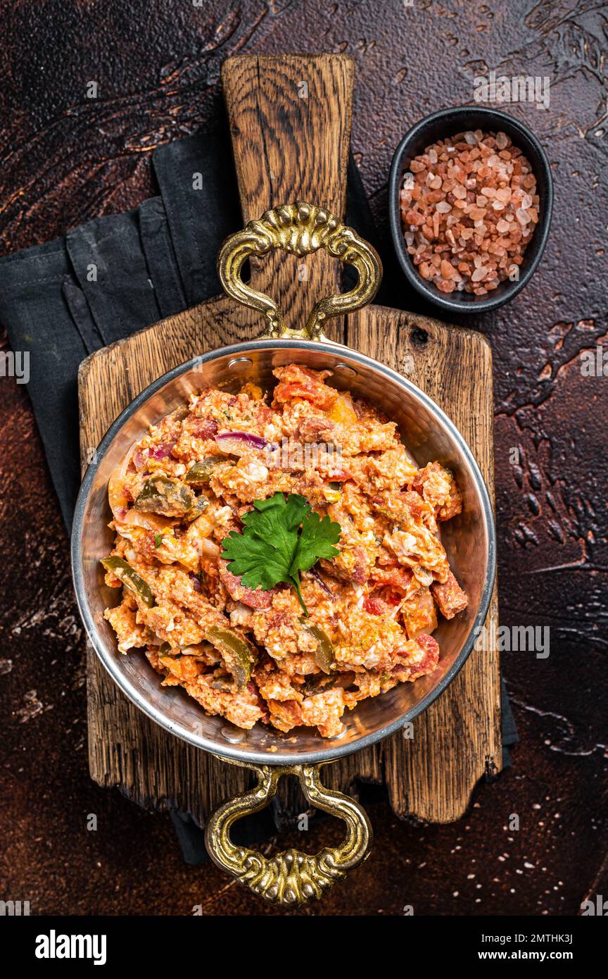 Turkish Menemen omelet with vegetabls and sucuk in askillet. Dark ...