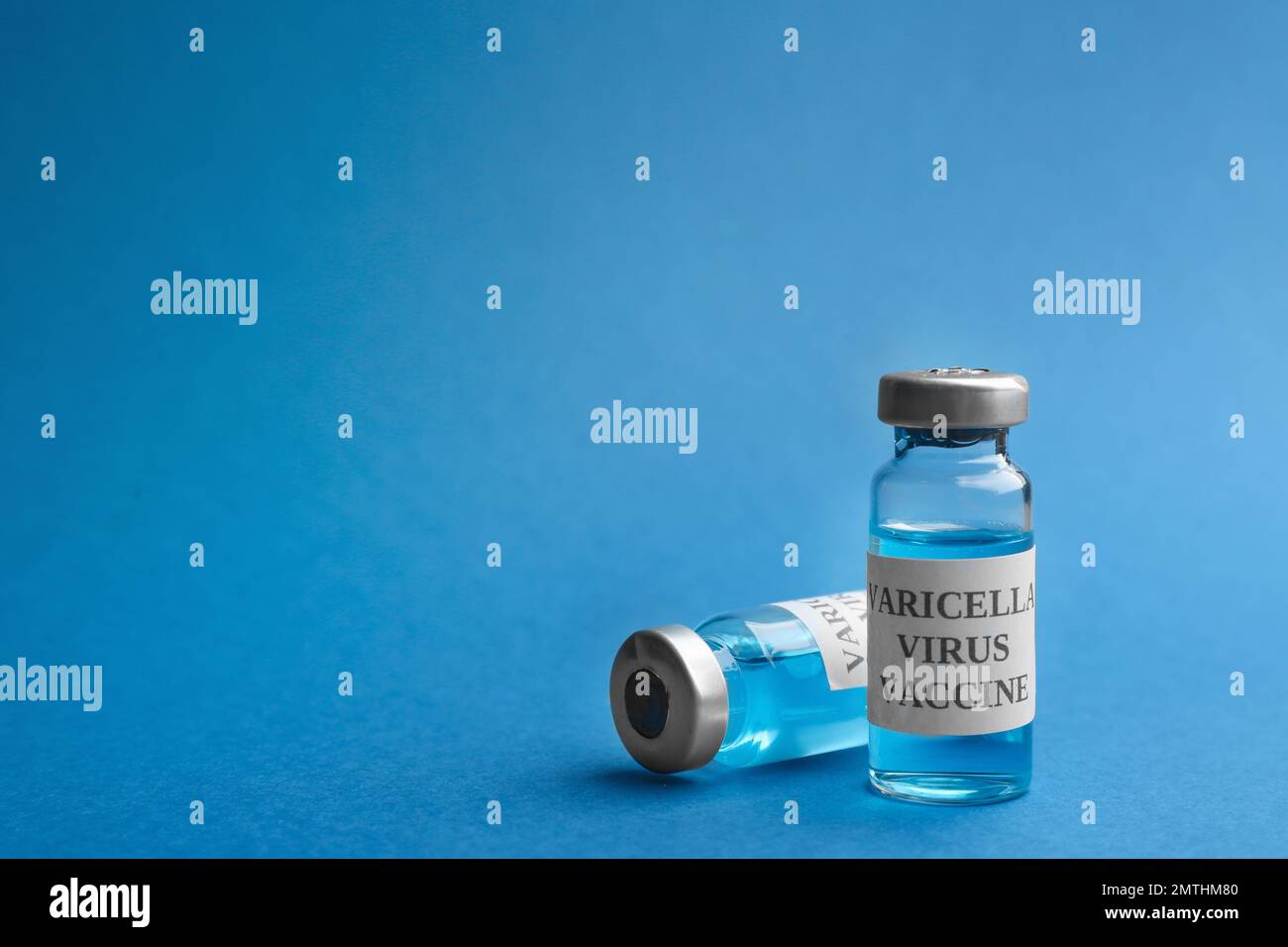 Chickenpox vaccine on blue background, space for text. Varicella virus ...
