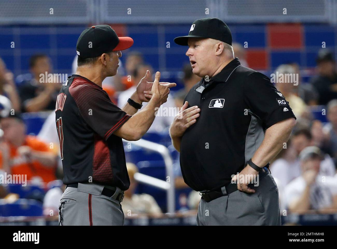 Arizona Diamondbacks manager Torey Lovullo, left, argues a call with ...