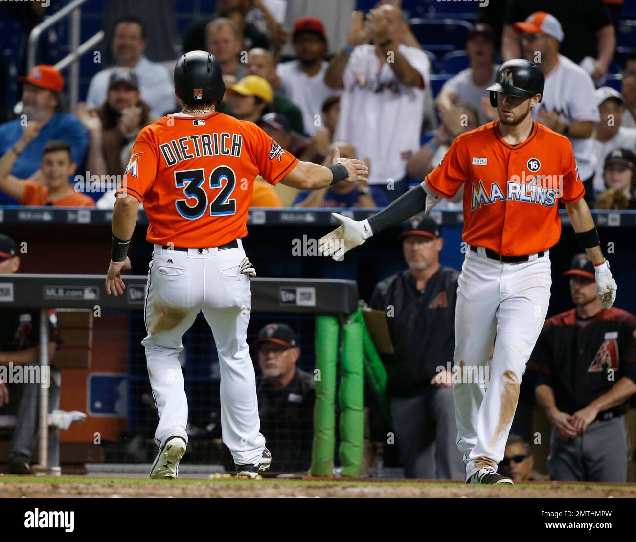 Miami Marlins' Derek Dietrich (32) is congratulated by JT Riddle after ...