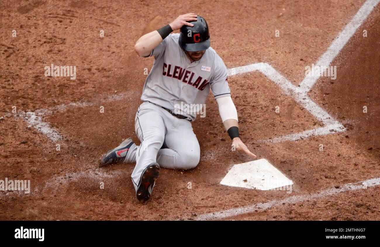 Cleveland Indians' Jason Kipnis slides home to score on a two-run ...
