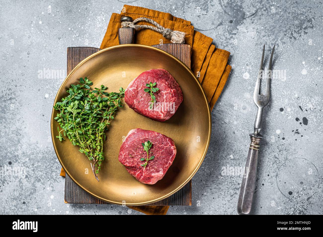 Dry aged Fillet Mignon Beef steak with herbs, raw marble meat. Gray ...