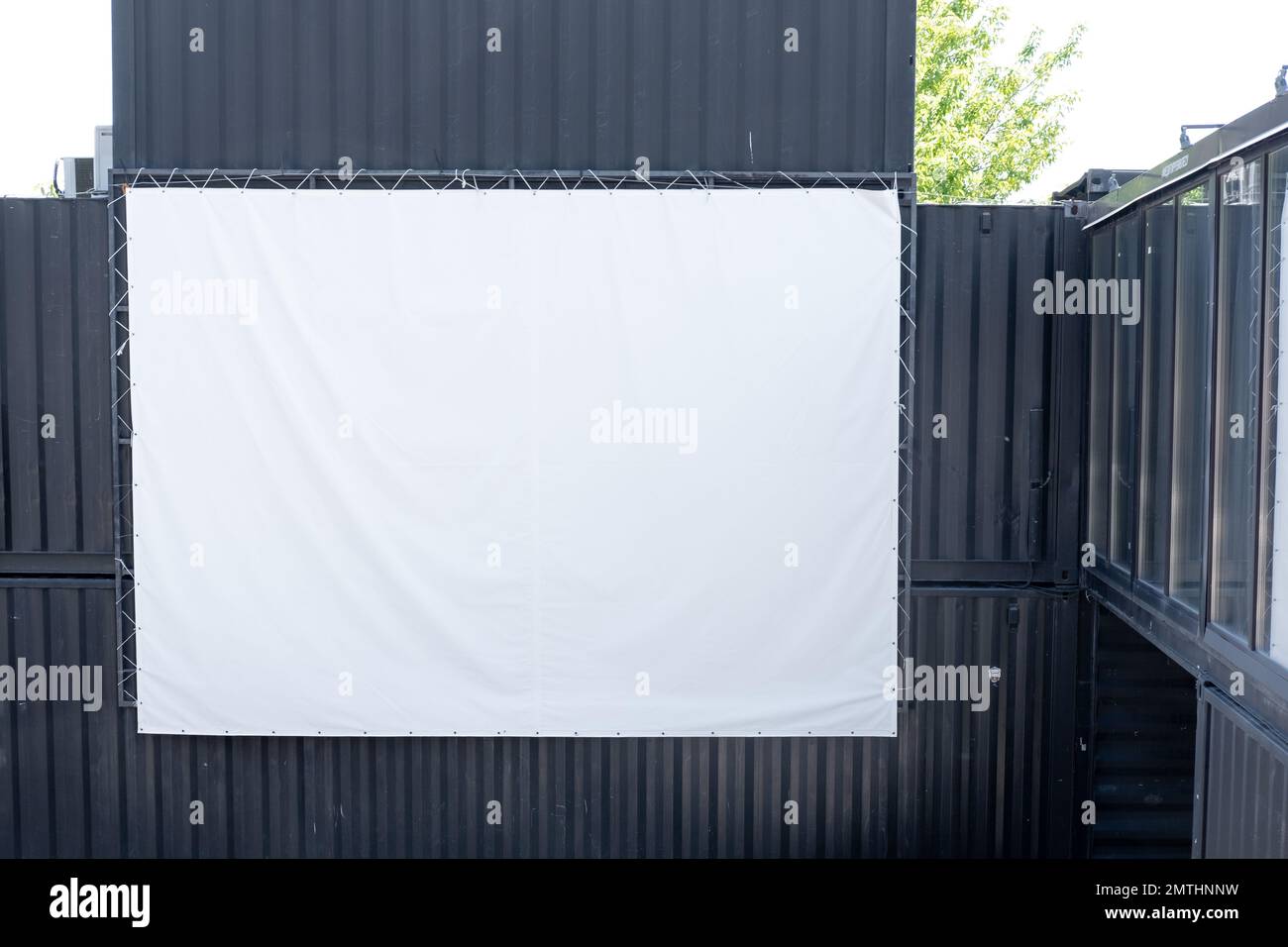 empty white screen for showing a movie, on the street Stock Photo - Alamy