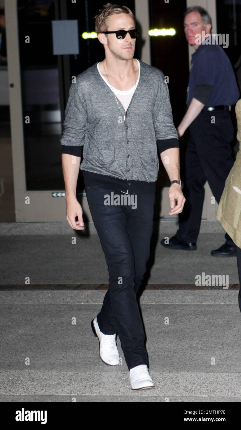 Actor Ryan Gosling looks very stylish in a pair of white shoes and a ...