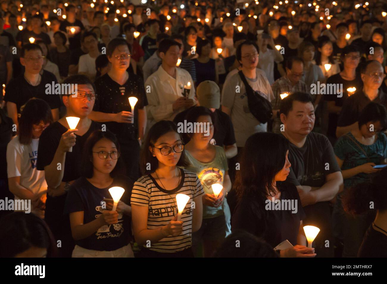 Tens of thousands of people attend an annual candlelight vigil at Hong Kong's Victoria Park ...