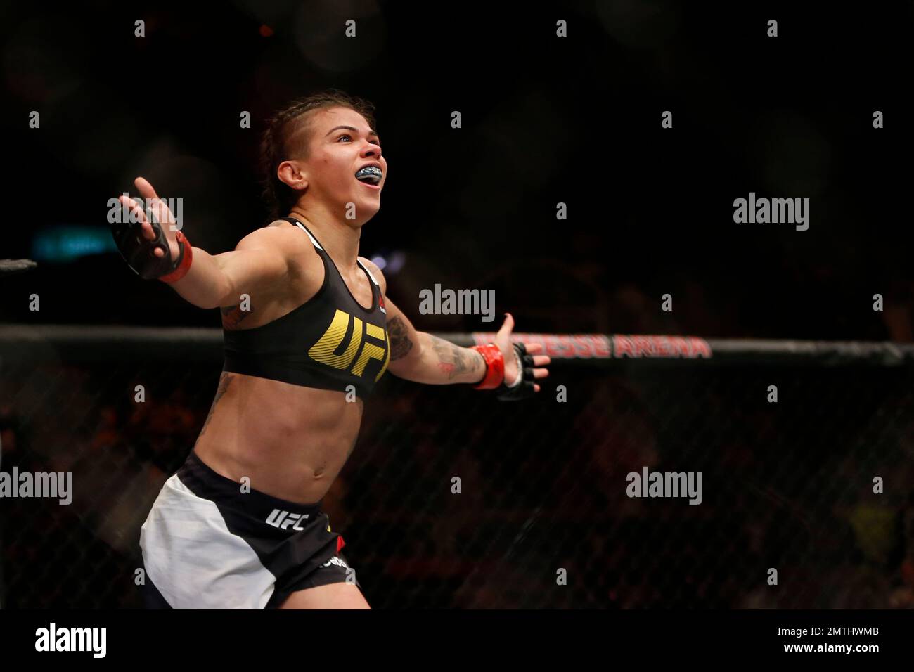 Claudia Gadelha, of Brazil, celebrates after defeating Karolina ...