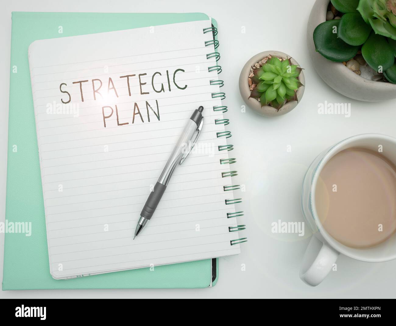 Hand writing sign Strategic Plan. Concept meaning A process of defining ...